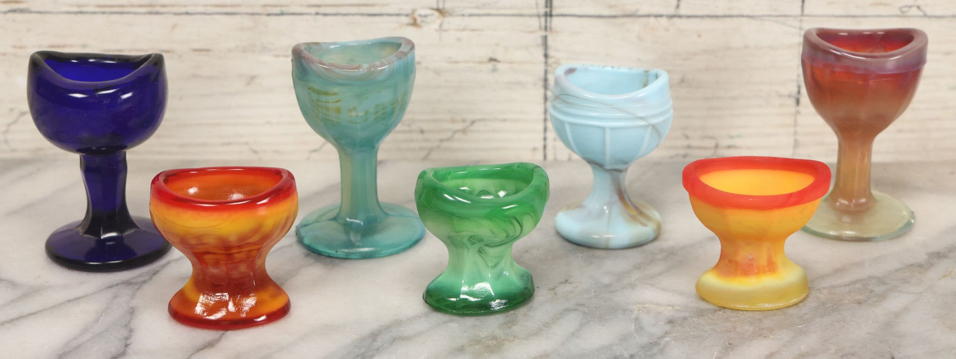 Lot 023 - Grouping Of Seven Vintage Colorful Swirled Slag Glass Eye Wa ...