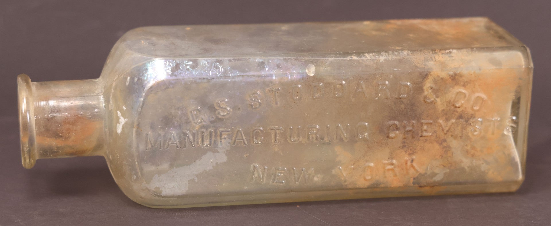 Lot 076 - Grouping Of Three Antique Clear Glass Bottles Including Emba ...